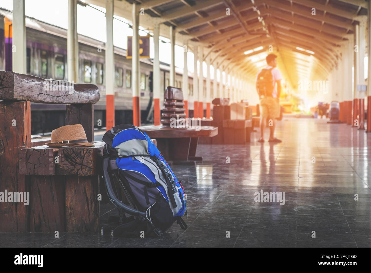 Traveler's bag at a train station Stock Photo - Alamy
