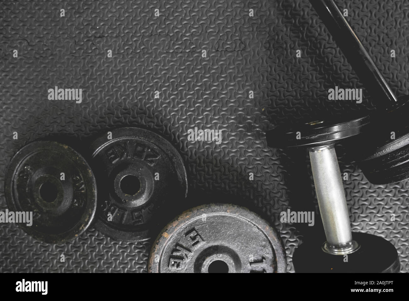 exercise weights - iron dumbbell with extra plates Stock Photo - Alamy