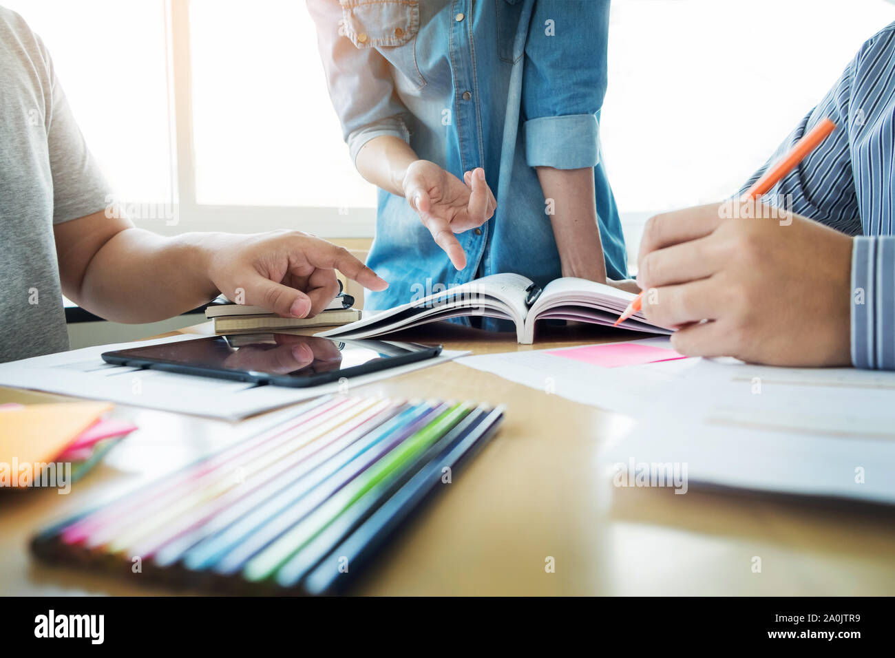 Young students campus helps friend catching up and learning tutoring ...