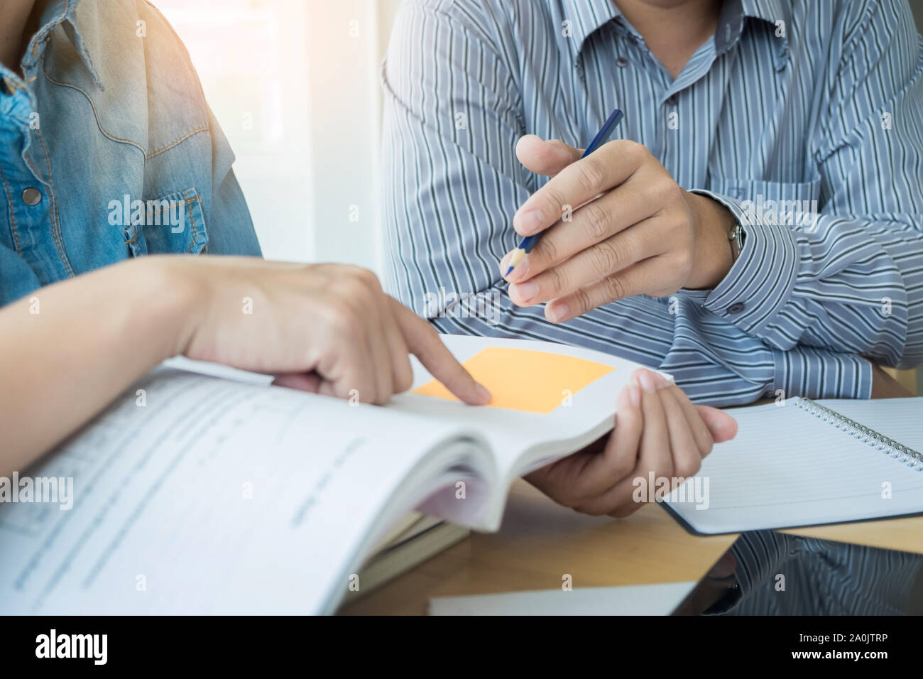 Young students campus helps friend catching up and learning tutoring ...