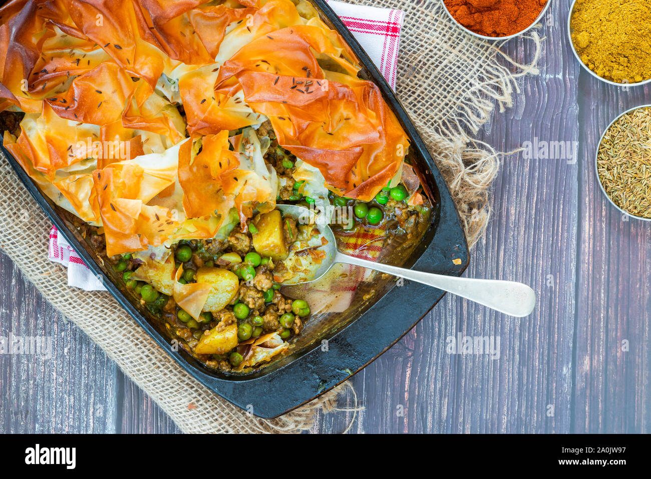 Lamb samosa pie - popular Indian dish with a savoury filling - overhead ...