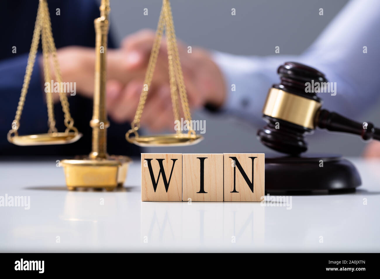 Win Word In Front Of Justice Scales And Gavel With Client And Lawyer ...