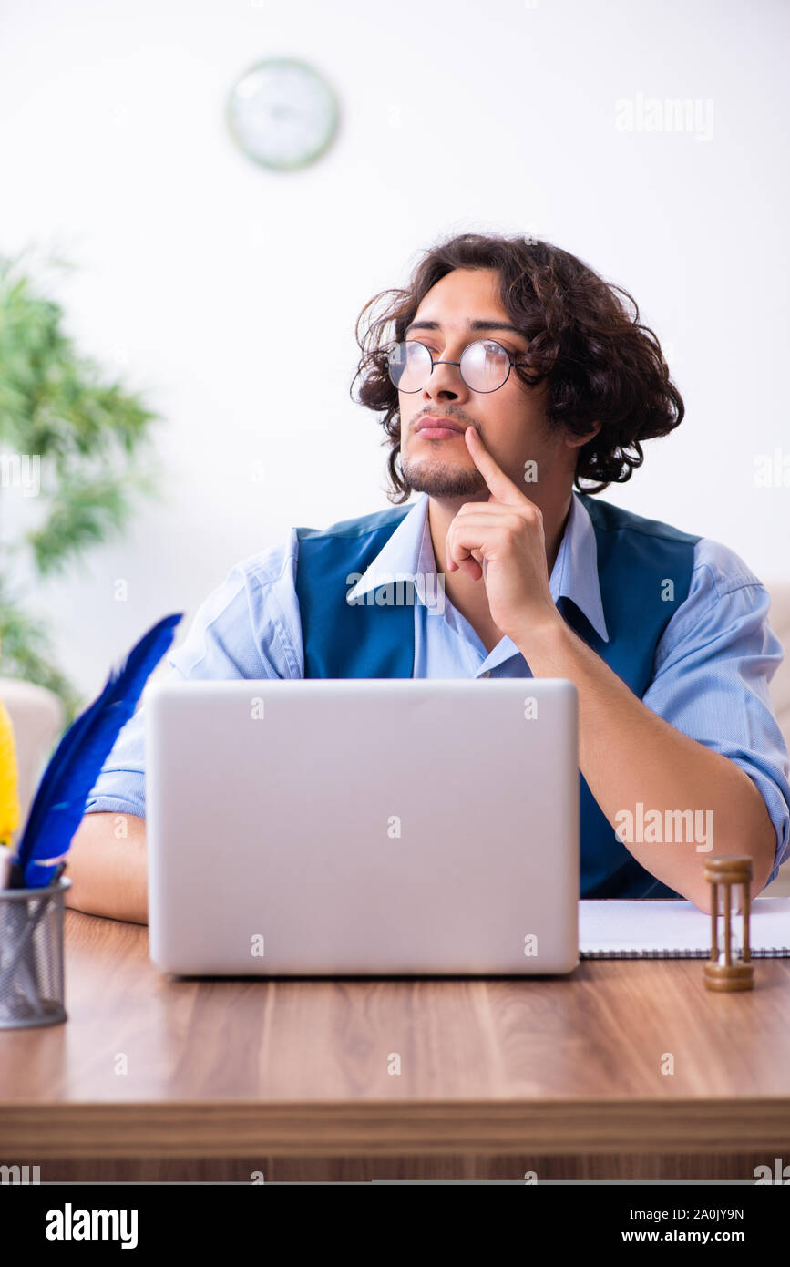 The young writer working on his new work Stock Photo - Alamy