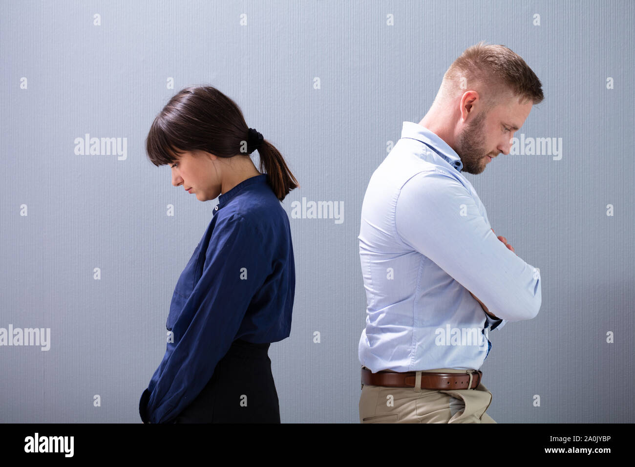 Side View Of A Depressed And Sad Couple Ignoring Each Other Standing ...