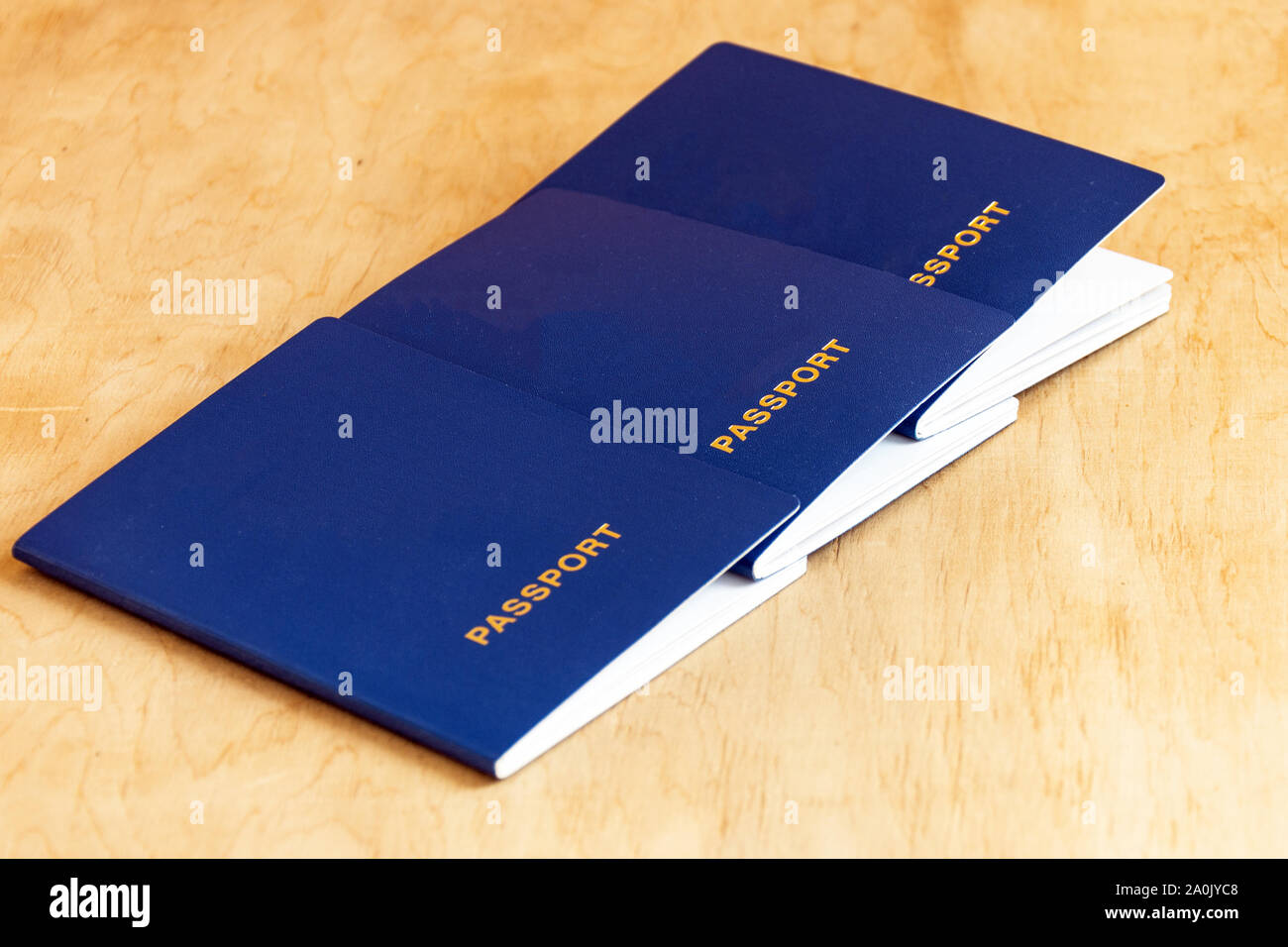 Row of passports on wooden background. Travelling. Security border ...