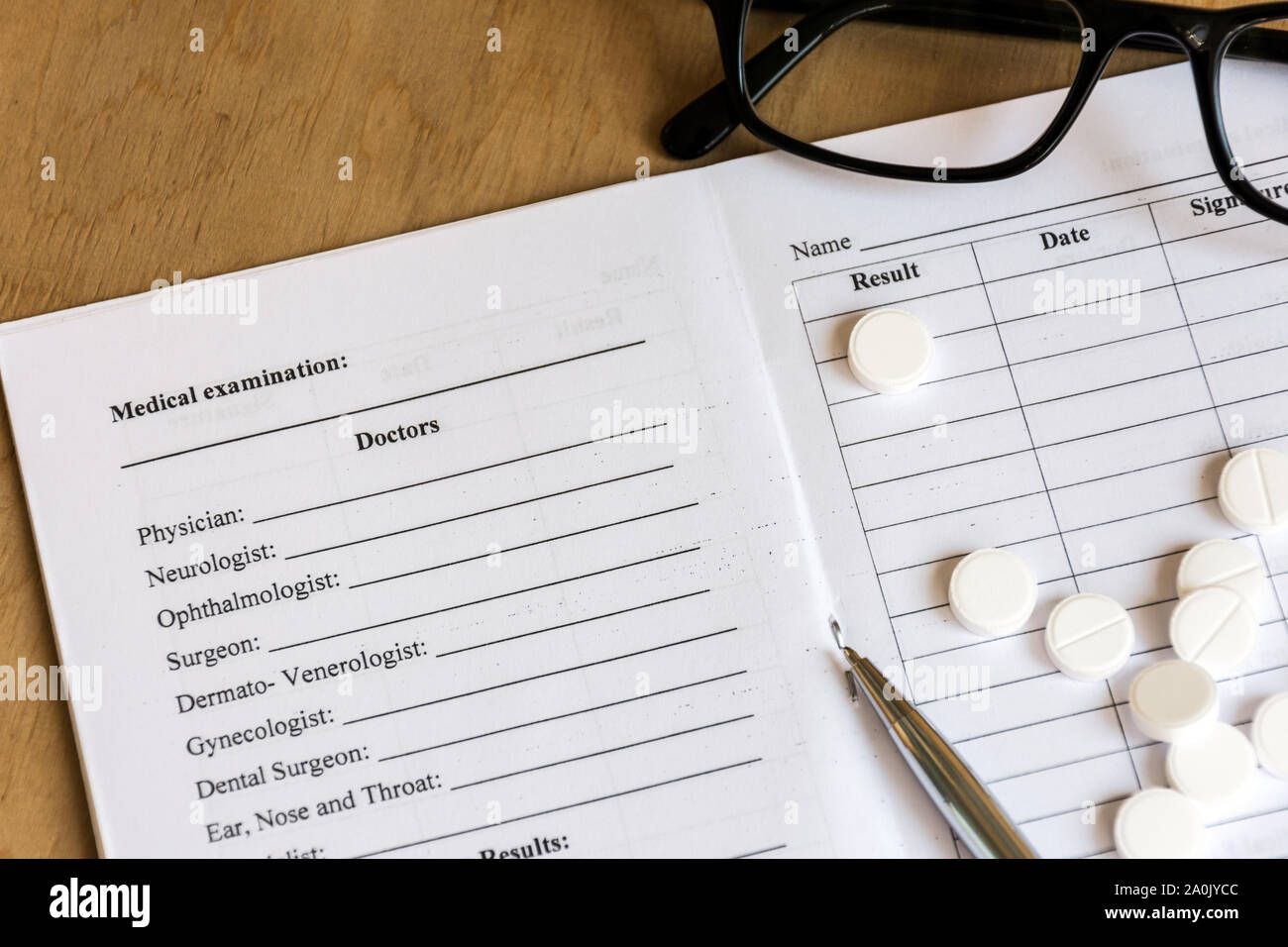 Medical examination paper on wooden background. Health case details of ...