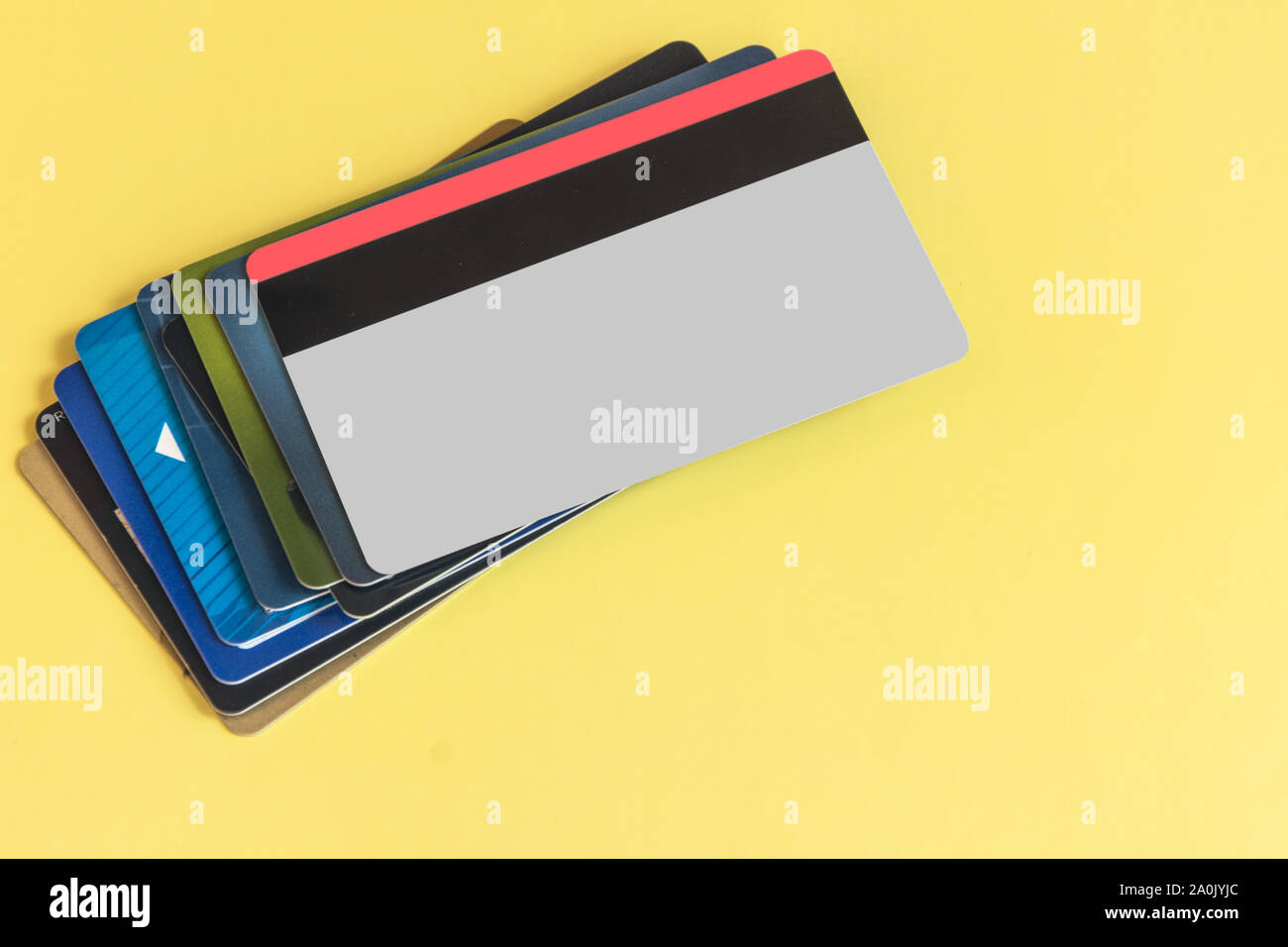 Stack fo colorful credit cards on pastel color background. Banking ...