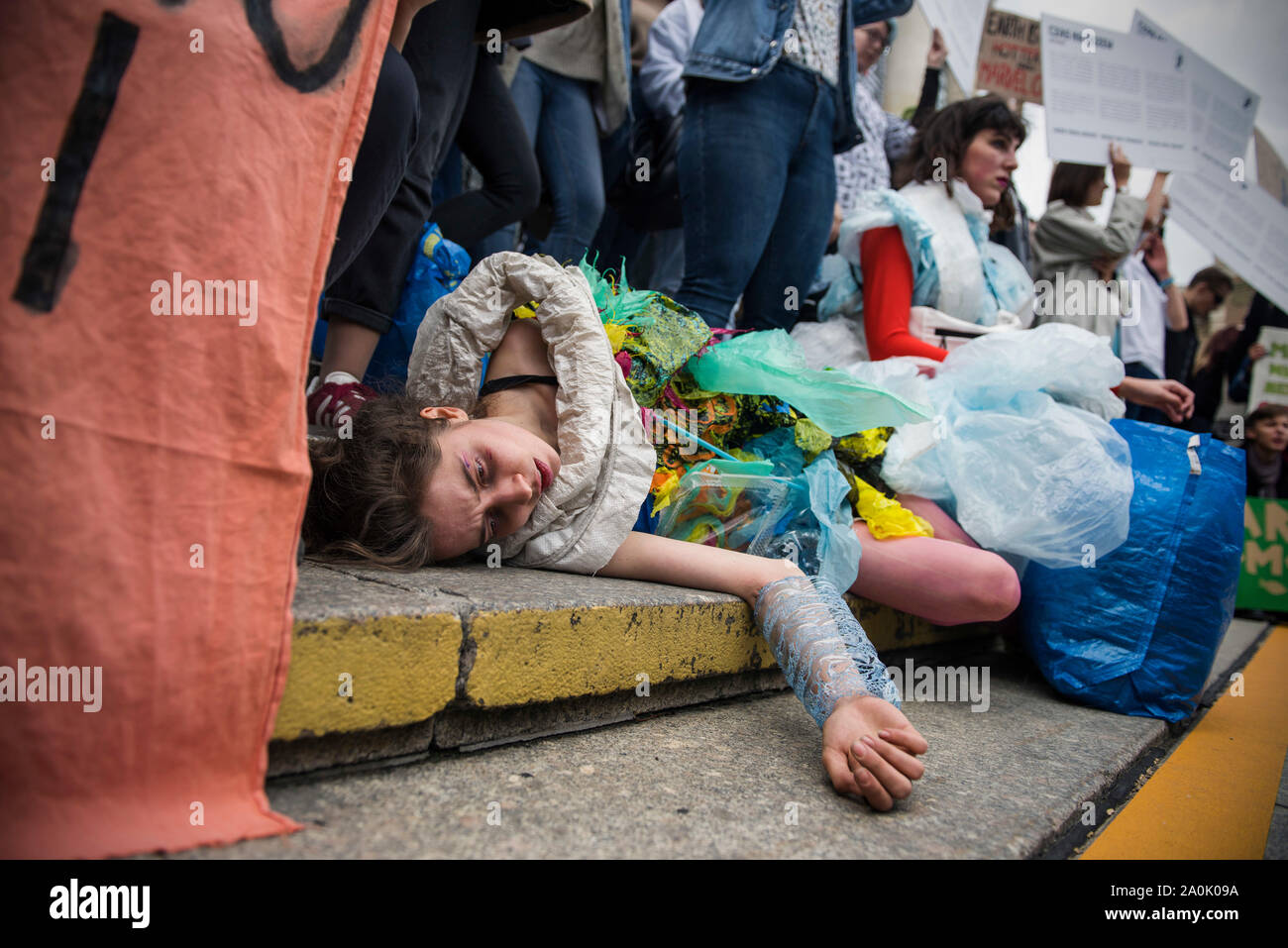 A protester dressed as planet earth in agony during the climate change ...