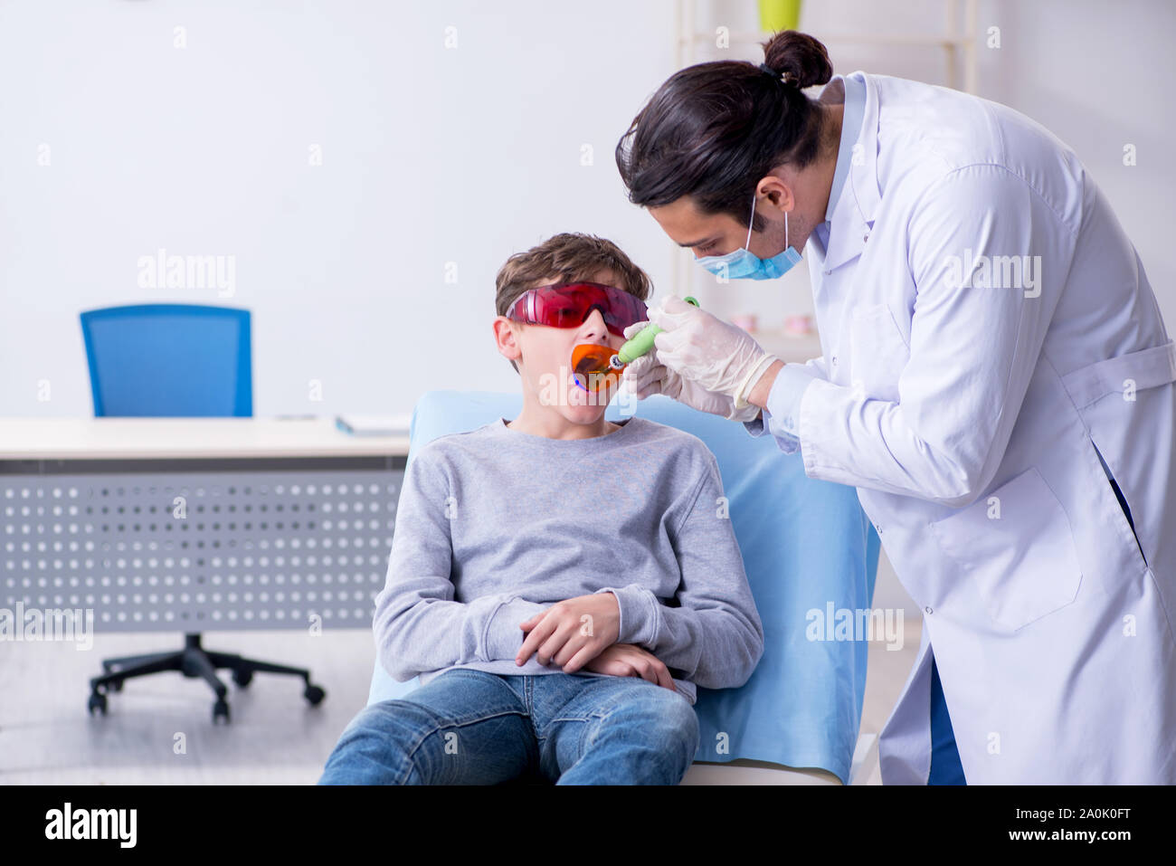 The young boy visiting doctor in hospital Stock Photo - Alamy