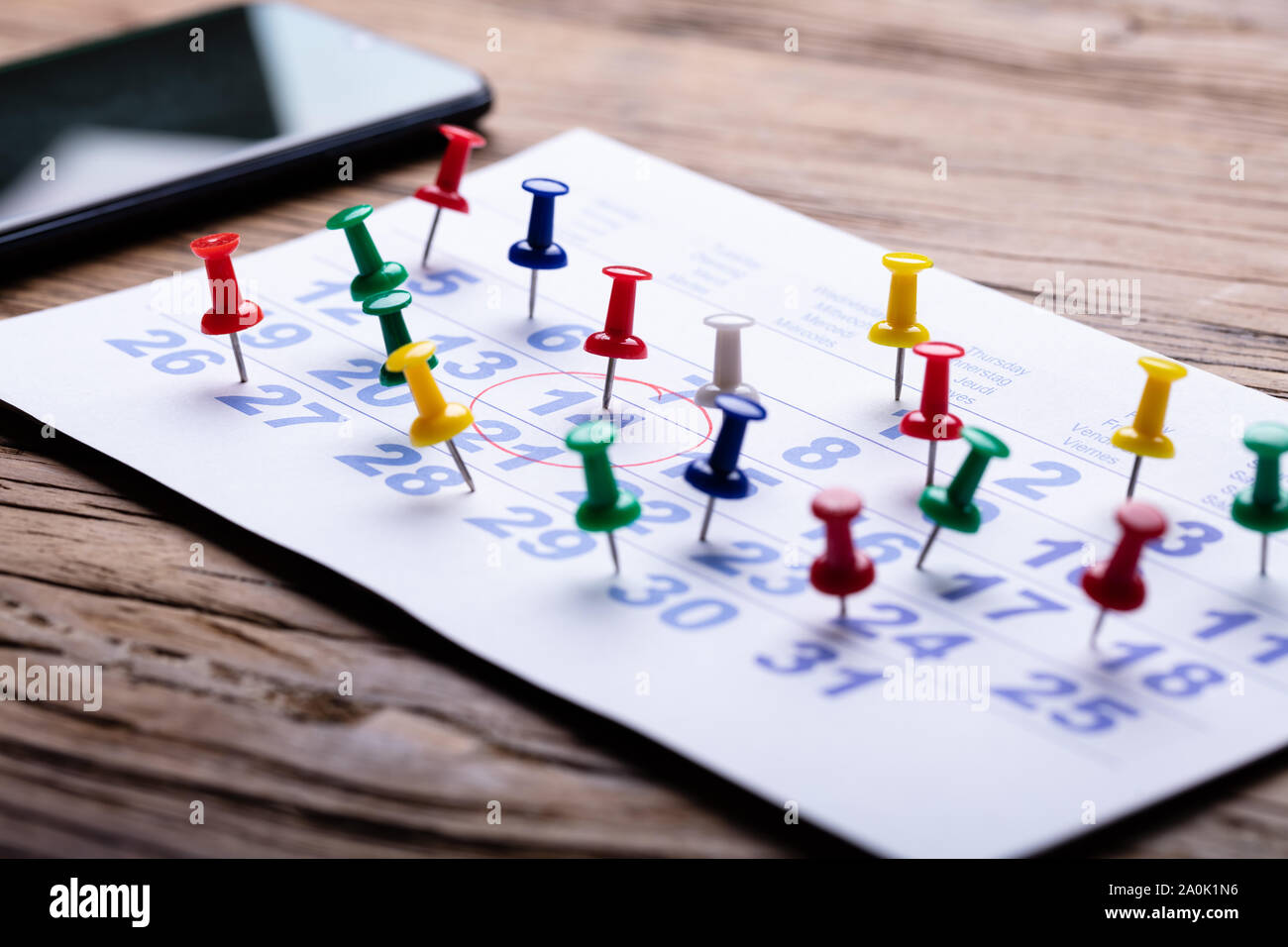 Calendar With Circular Mark Around 14 Number And Colorful Push Pins ...