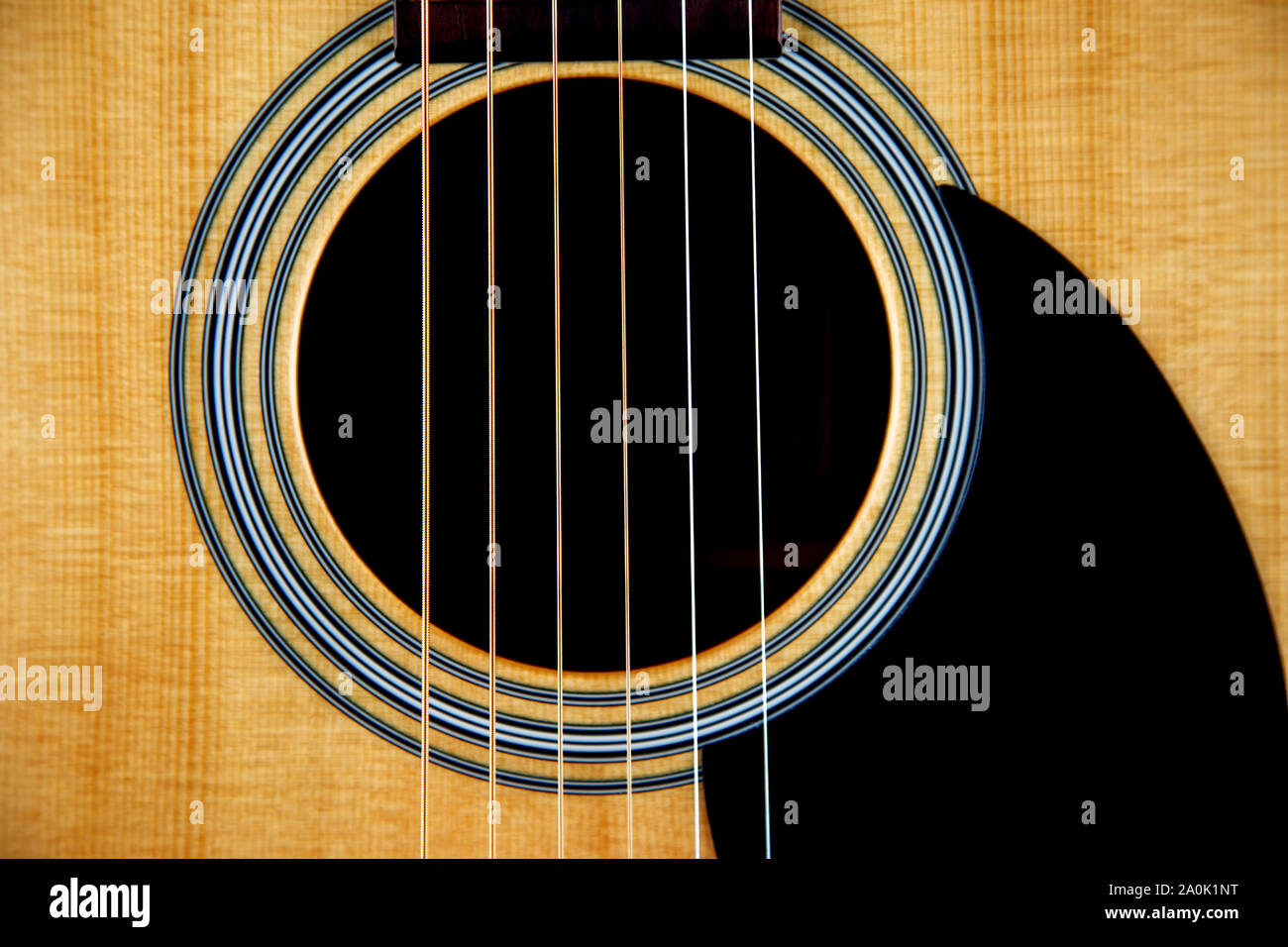 Acoustic guitar sound hole and strings close up Stock Photo - Alamy
