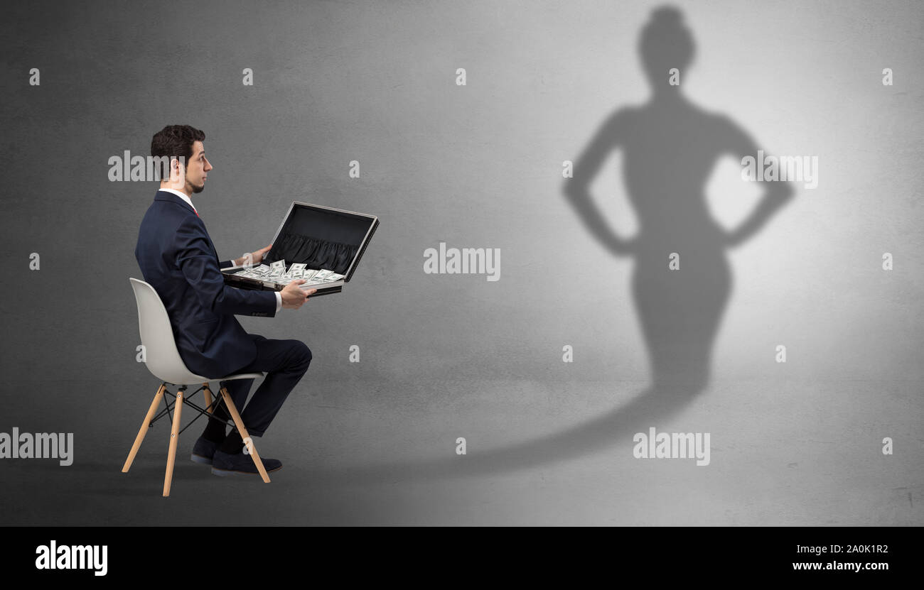 Rich businessman staying and offering stuffs to a pretty shadow woman ...