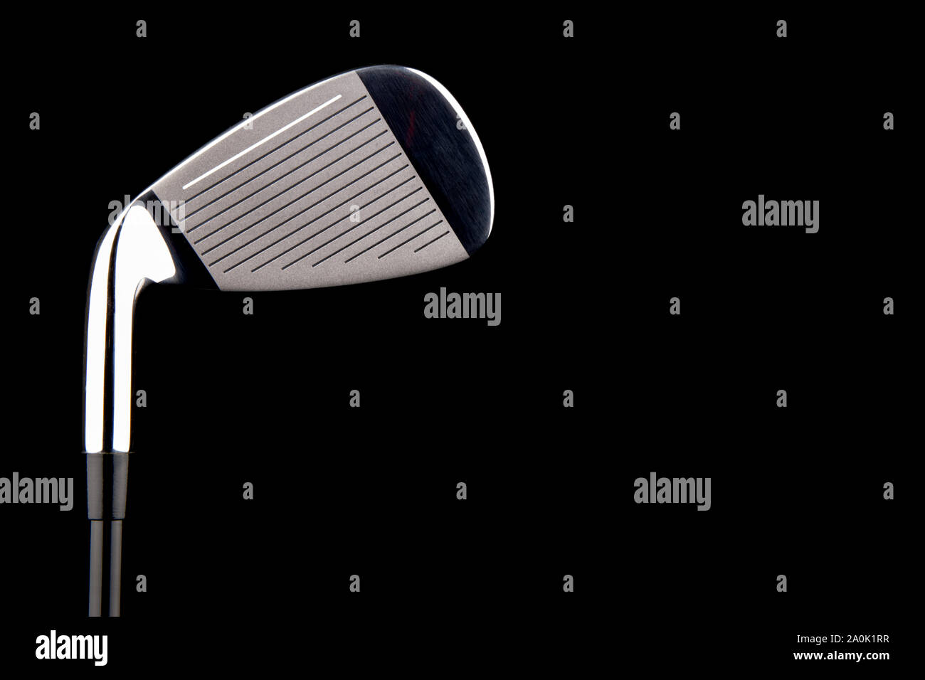Golf clubhead isolated against a black background Stock Photo - Alamy