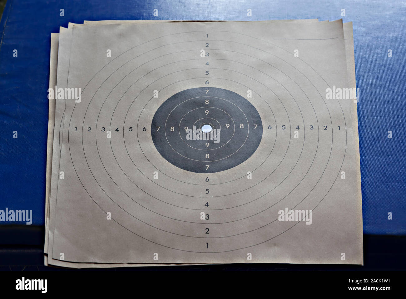 Old brown paper target with 10 radial layers for shooting practice ...