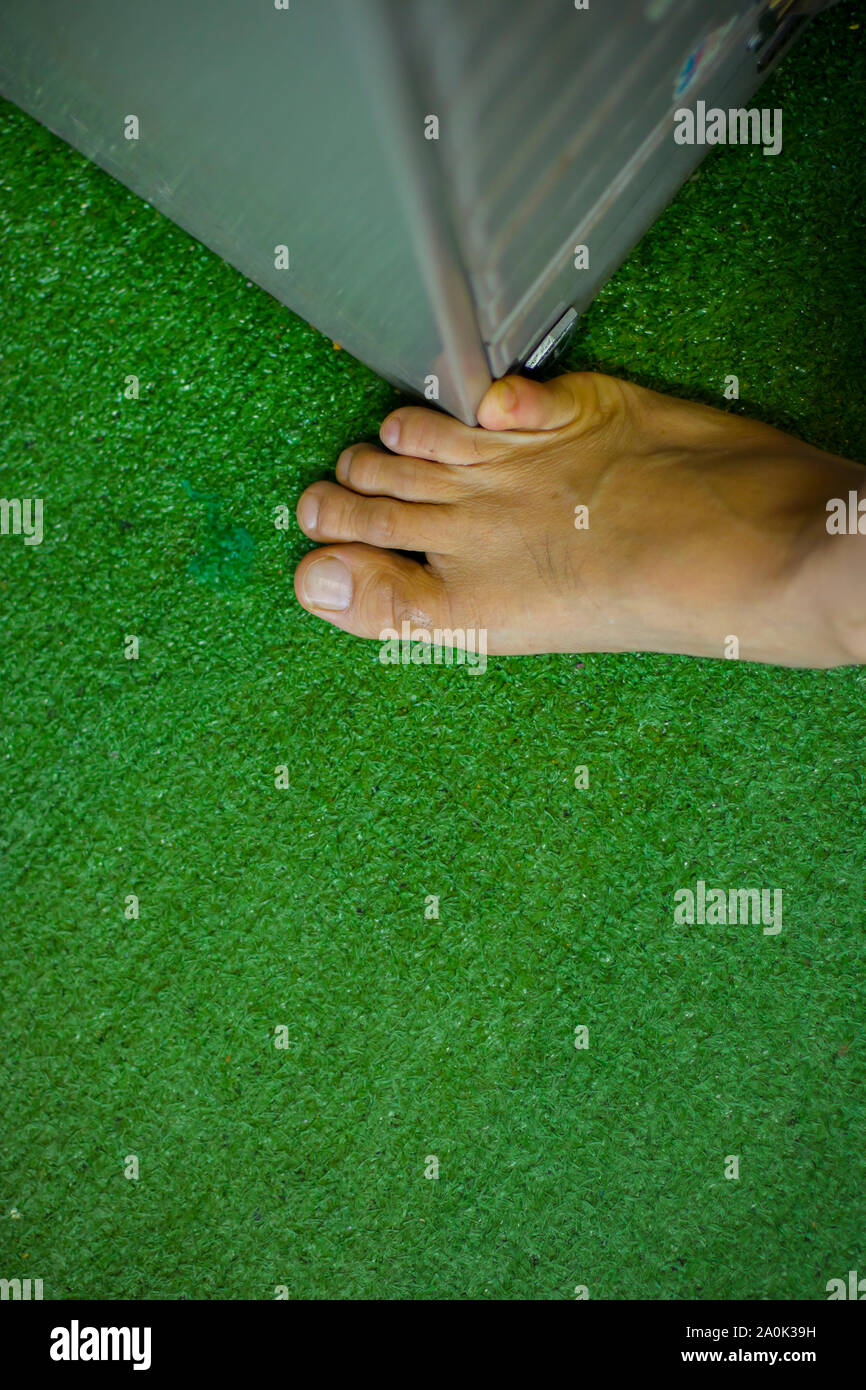 Male foot tripping with steel drawers and pain full. High resolution ...