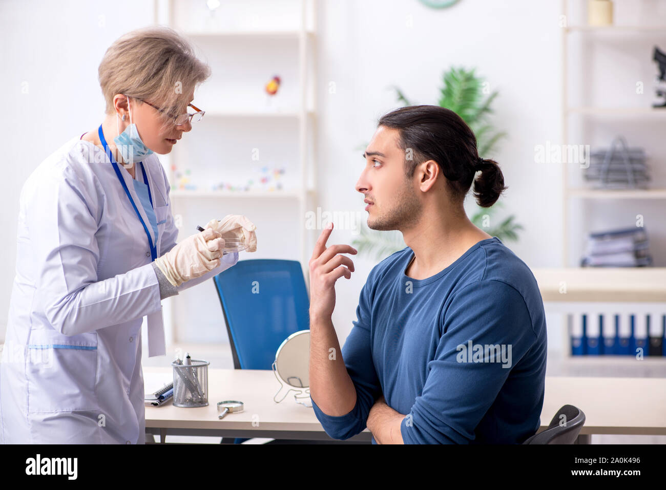 The young patient visiting doctor in hospital Stock Photo - Alamy