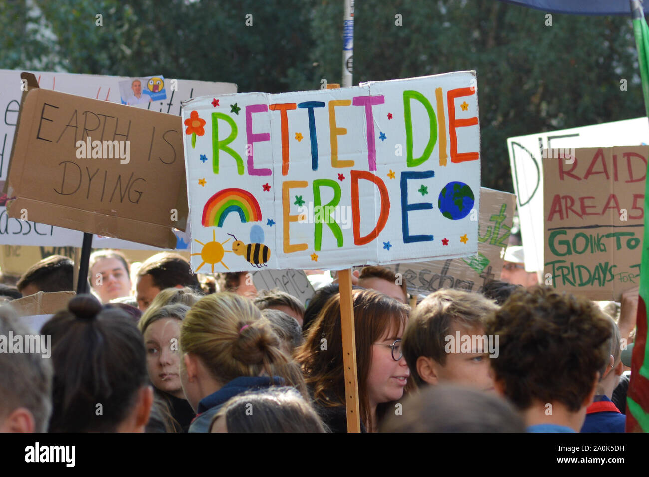 Demonstration during Global Climate Strike with cardboard banner saying ...