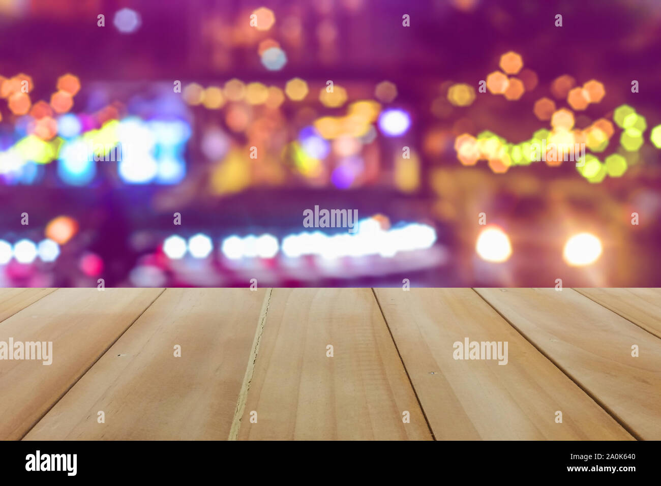 Wooden table montage on ultra violet blurry background for your product ...