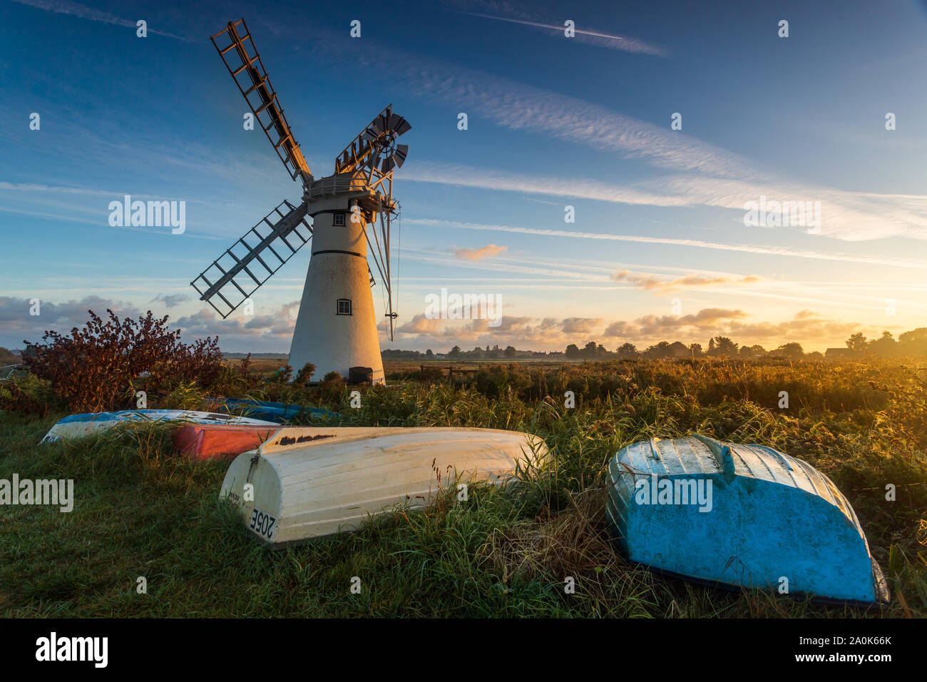 Sunrise colours on Thurne MIll on the Norfolk Broads in the UK Stock ...
