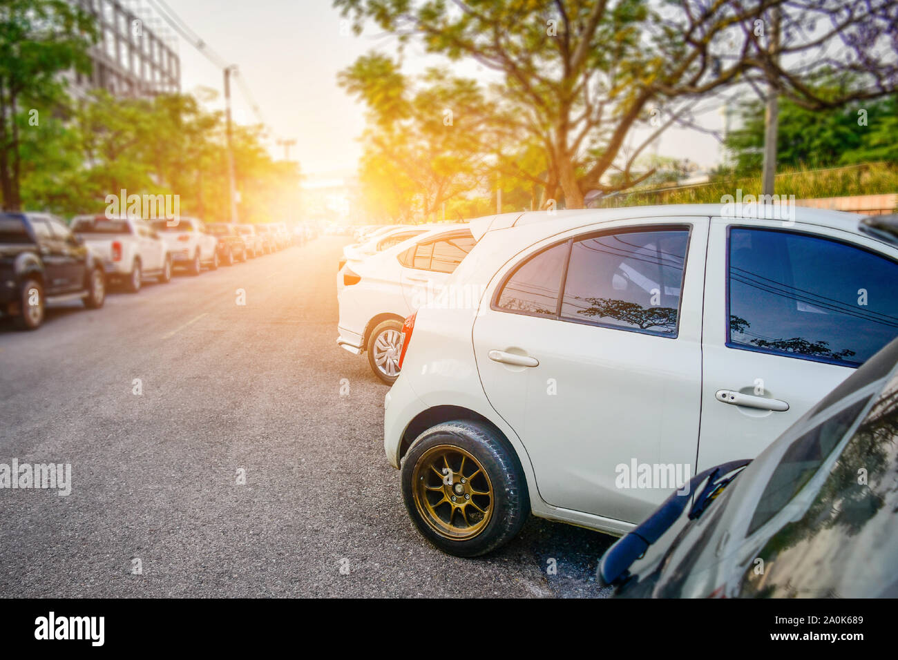 Car parked on street,Car parked on road,Cars a lot on road at sunlight ...