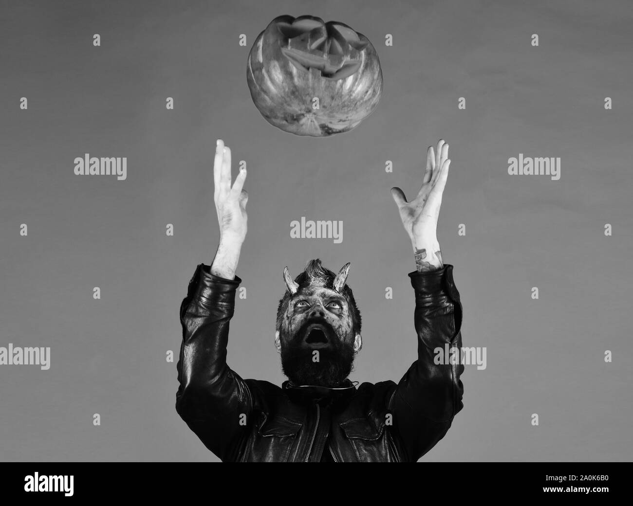 Halloween party concept. Devil or monster with October decorations ...