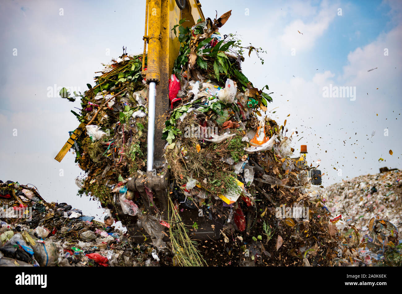 Excavator shovel removing trash Stock Photo - Alamy
