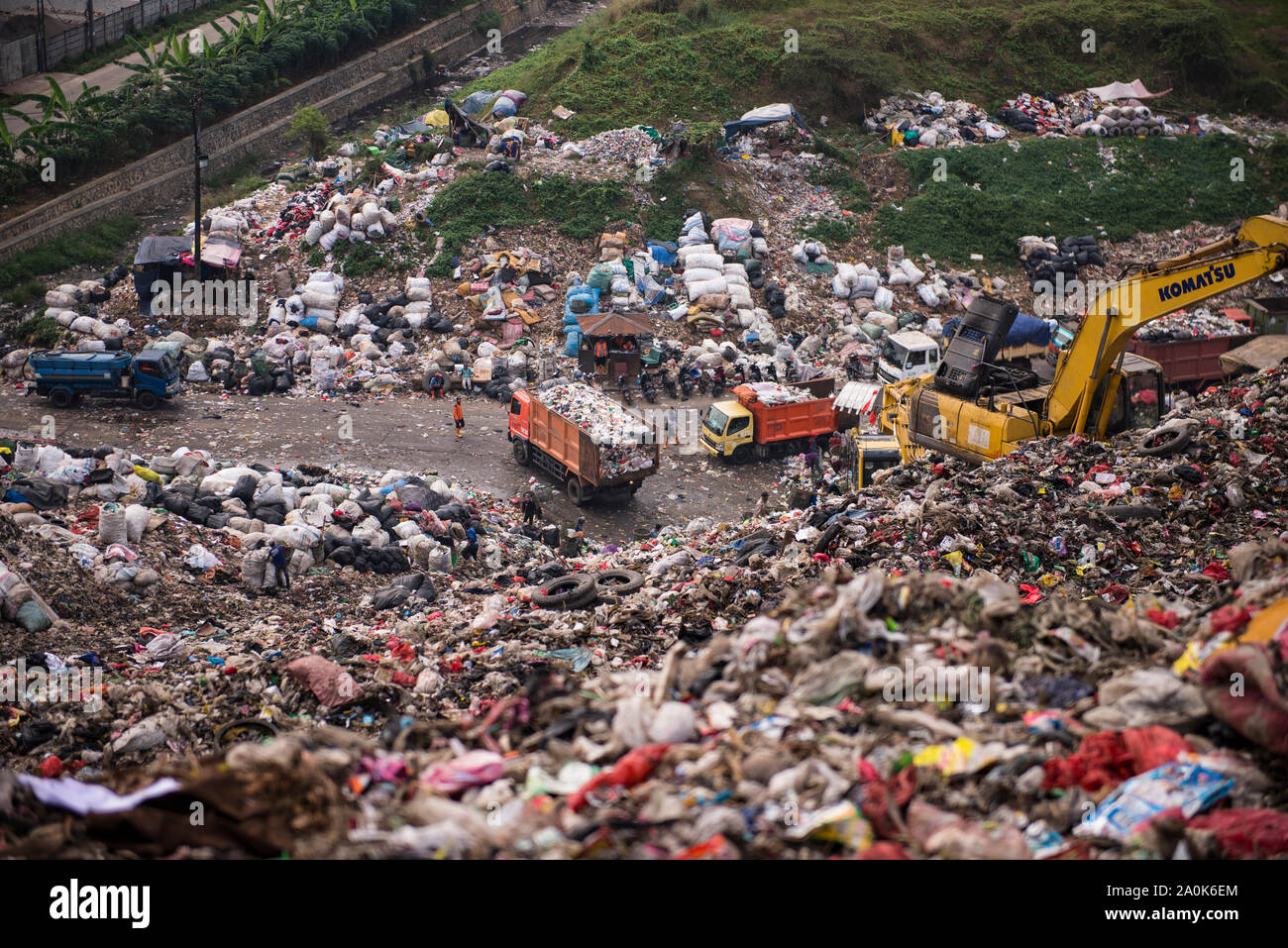 Overview of unloading garbage trucks at the landfill Stock Photo - Alamy