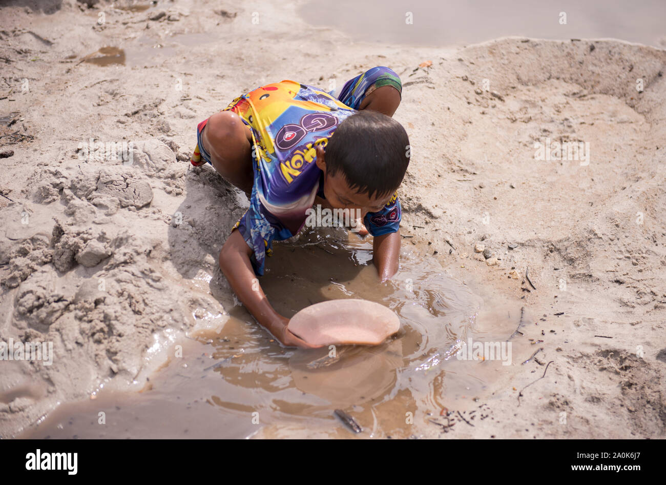 Boy playing to be a miner Stock Photo - Alamy