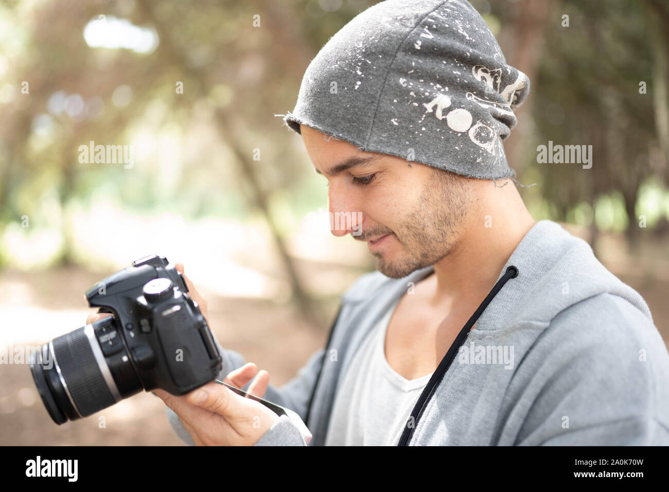 man working as a photographer shooting pictures and video editing Stock ...