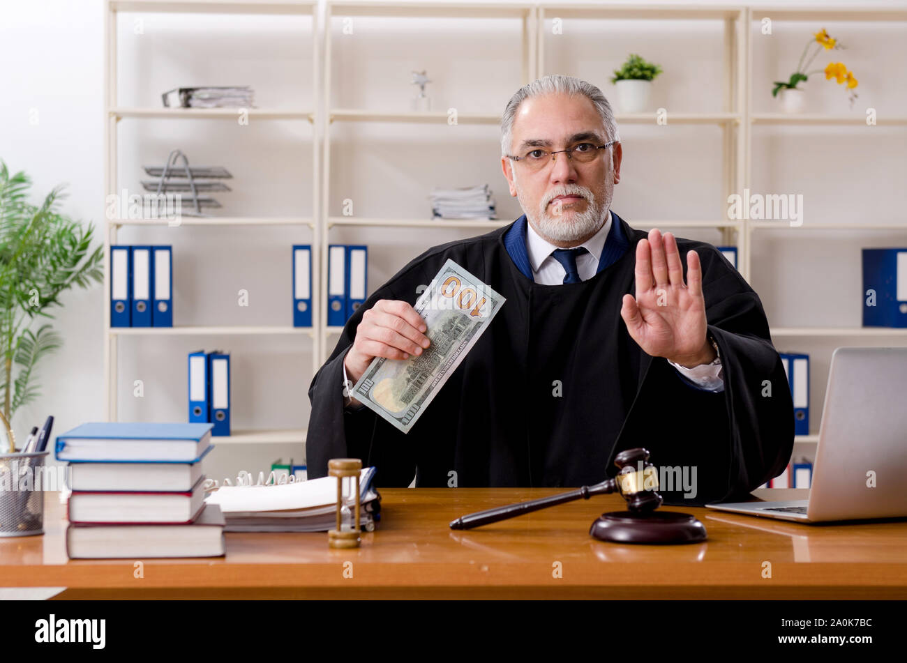 The aged lawyer working in the courthouse Stock Photo - Alamy