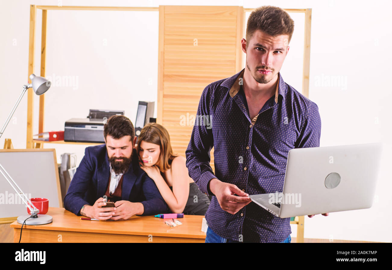 The best laptop for work. Businessman using laptop while collegues ...