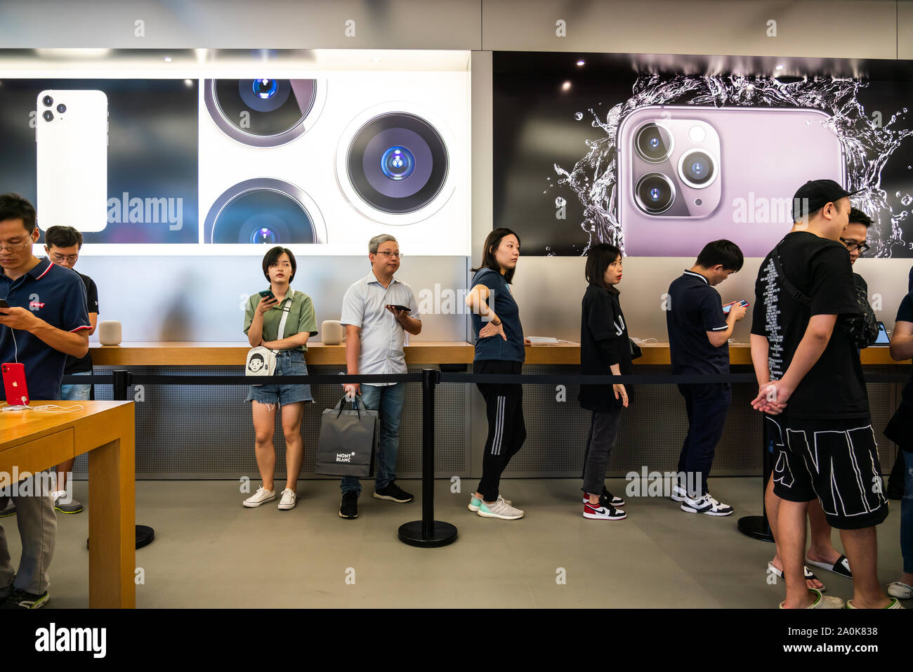 Customers line up to purchase Apple's new iPhone 11 series smartphones ...