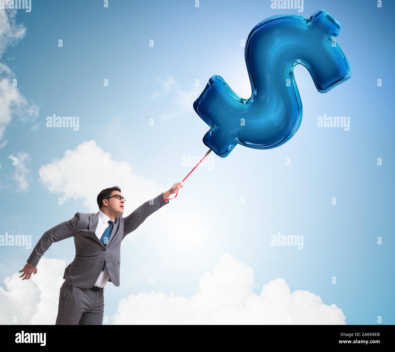 The businessman flying on dollar sign inflatable balloon Stock Photo ...