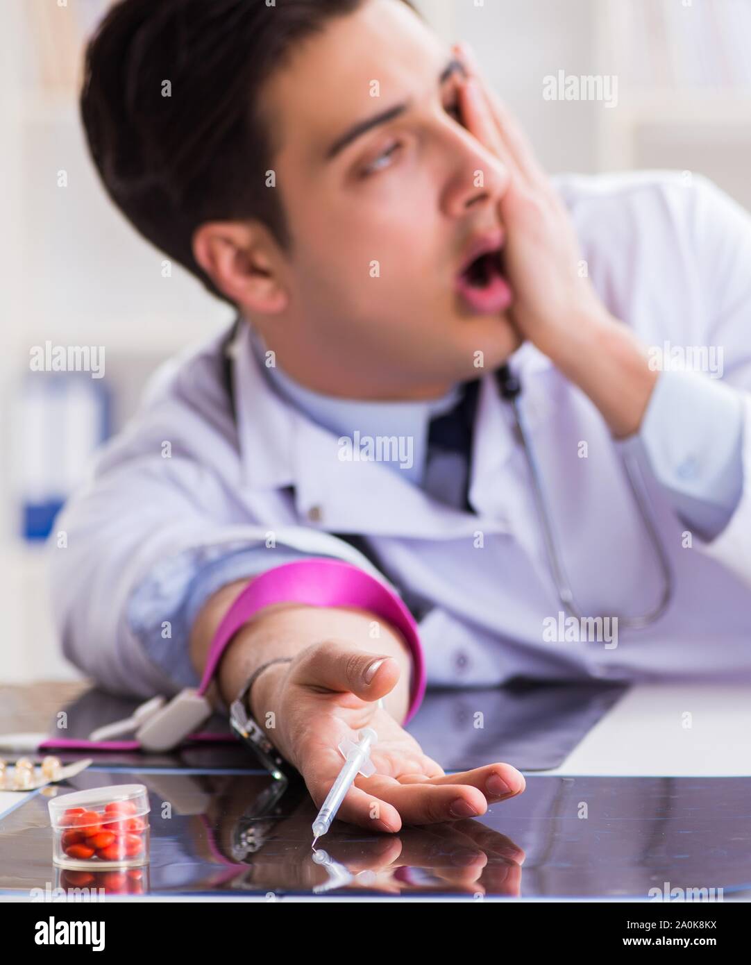 The doctor drug addict in the hospital Stock Photo - Alamy