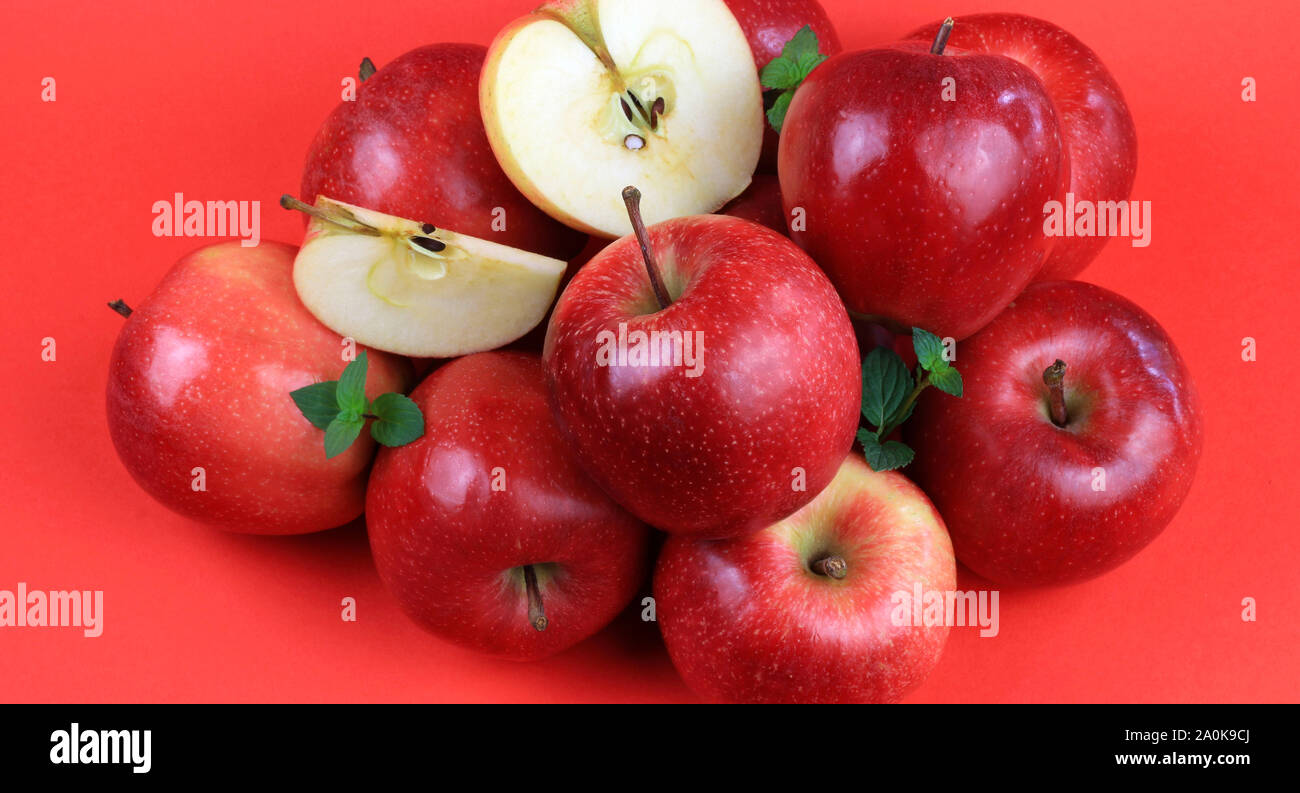 Fresh red apples on red background. Top view Stock Photo - Alamy