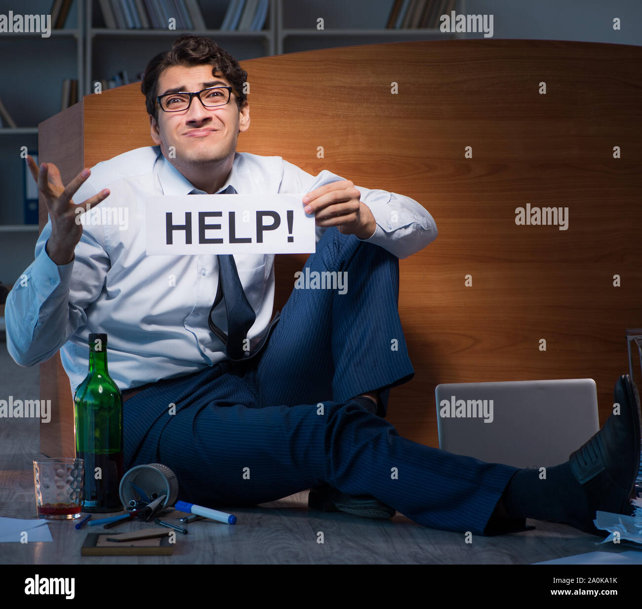 The employee asking for help and drinking under stress and despair ...