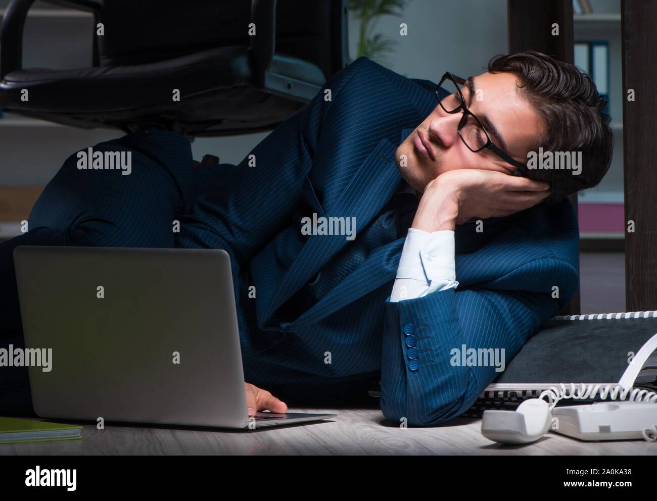 The businessman working overtime long hours late in office Stock Photo ...