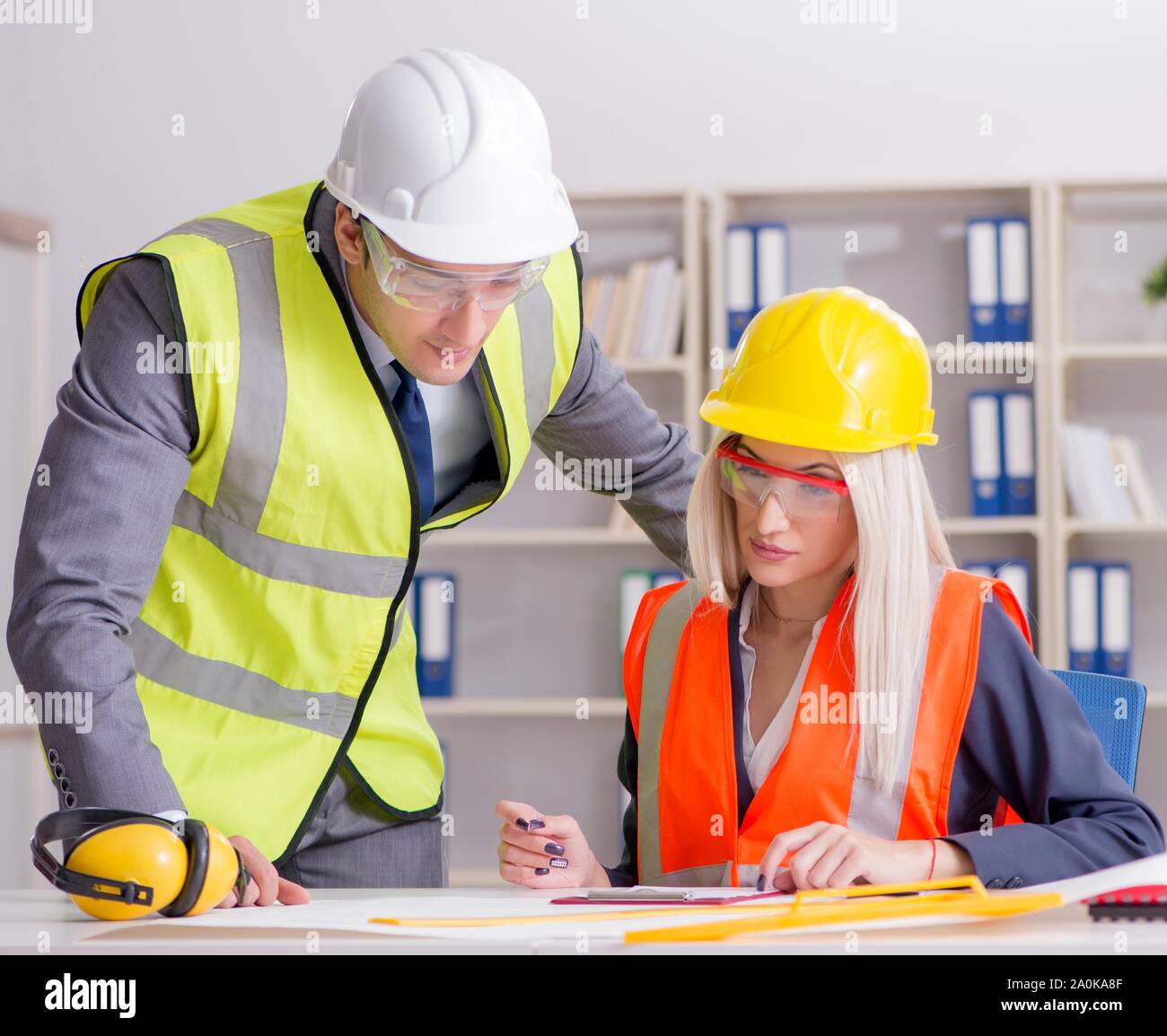 Construction workers checking drawing hi-res stock photography and ...