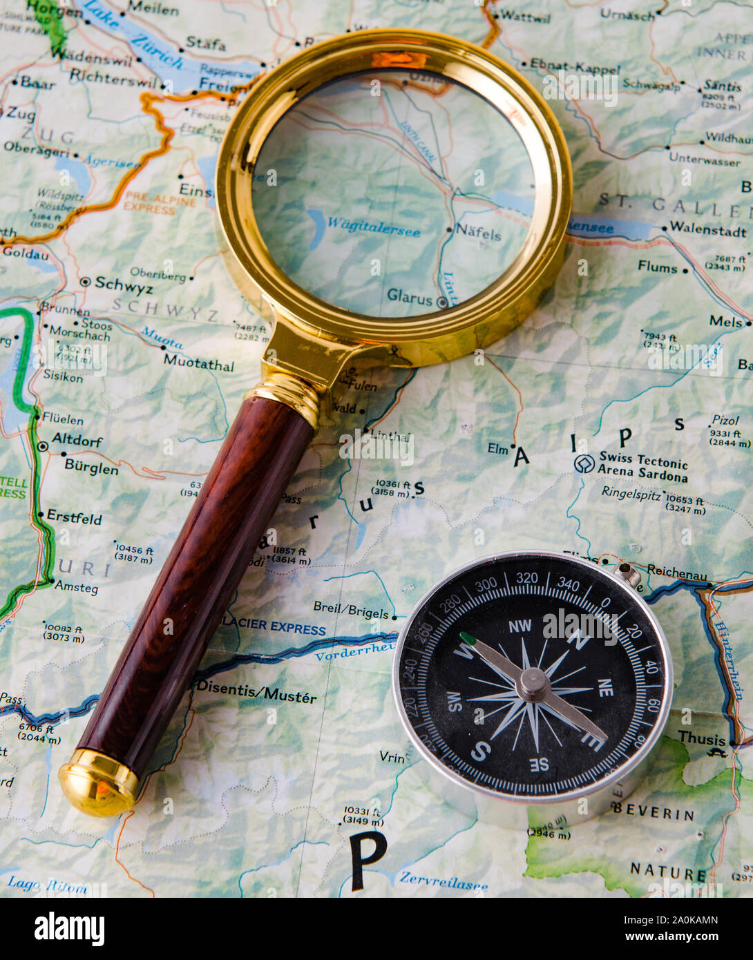 The travel concept with compass and map Stock Photo - Alamy