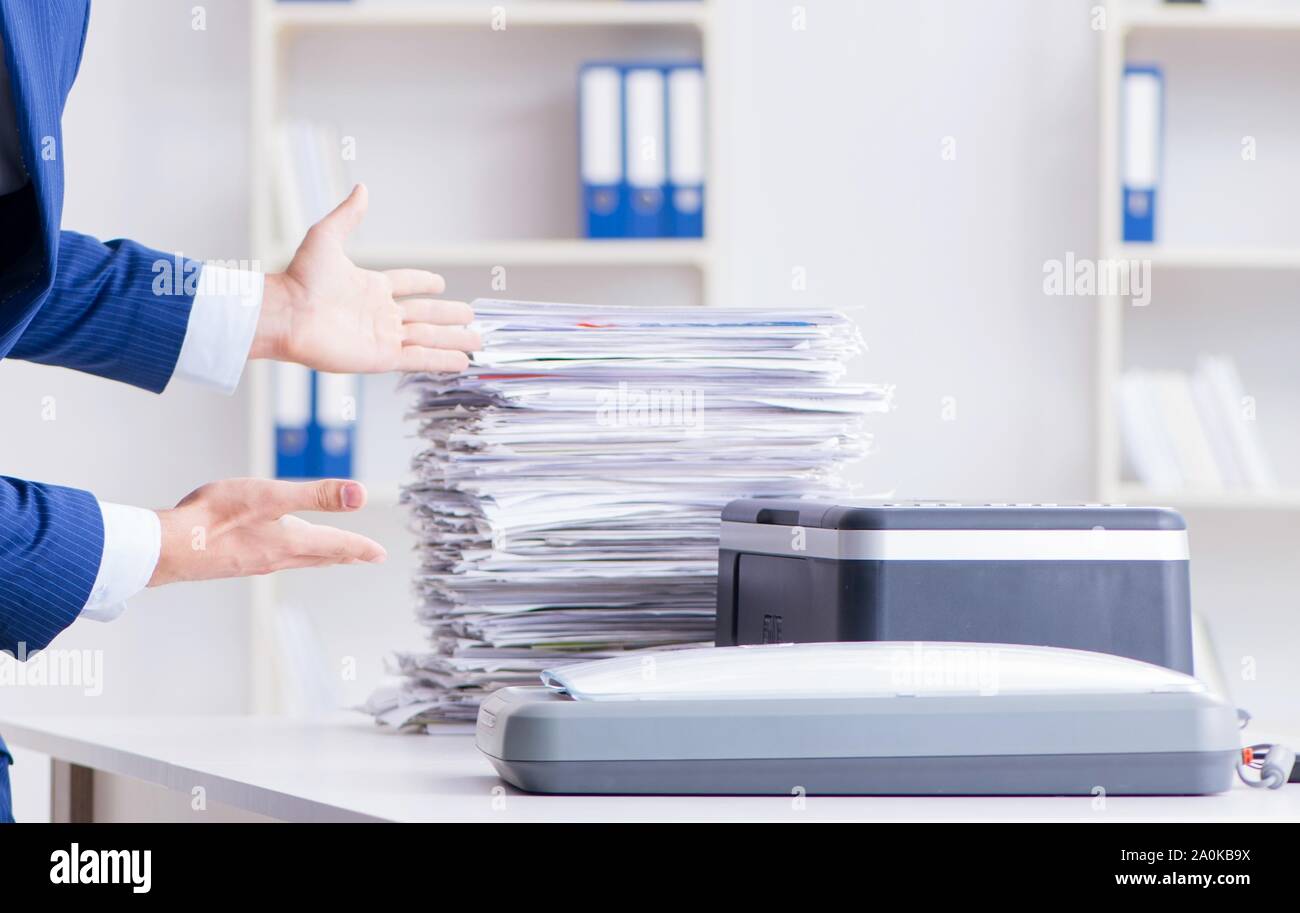 The businessman making copies in copying machine Stock Photo - Alamy