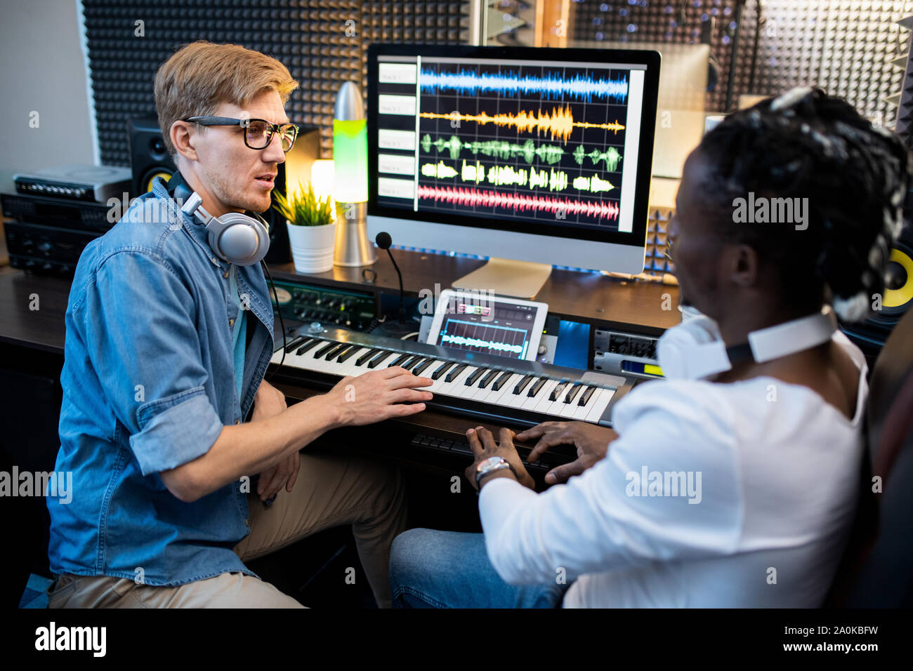 Two musicians in recording studio hi-res stock photography and images ...