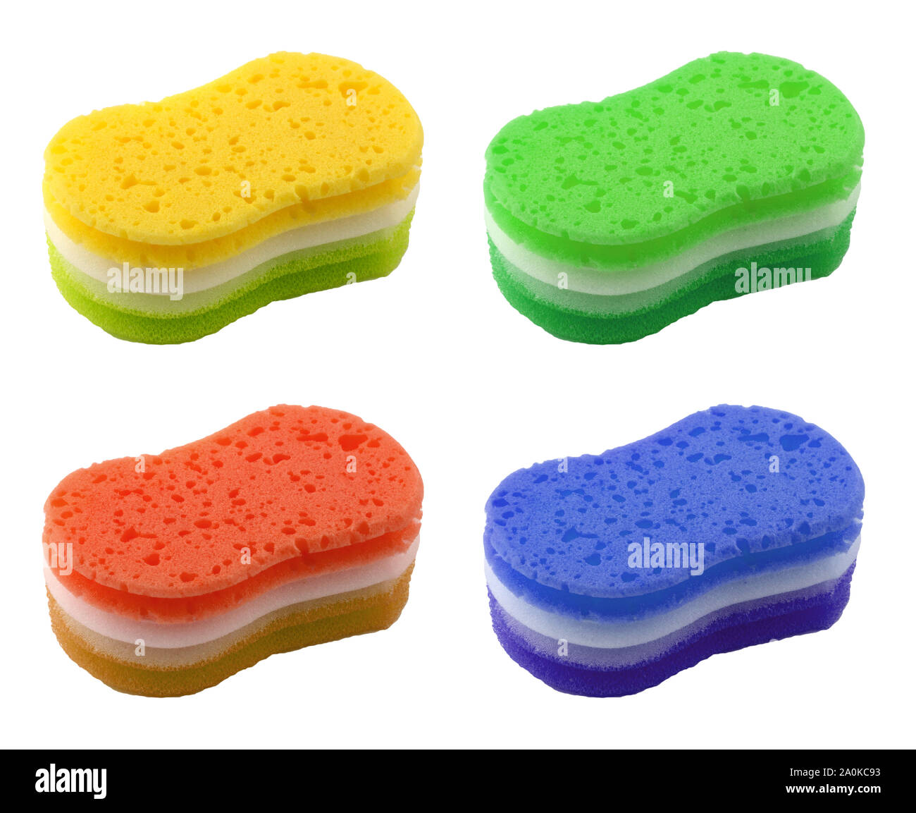 Set of sponges in different colors for washing dishes on a white ...