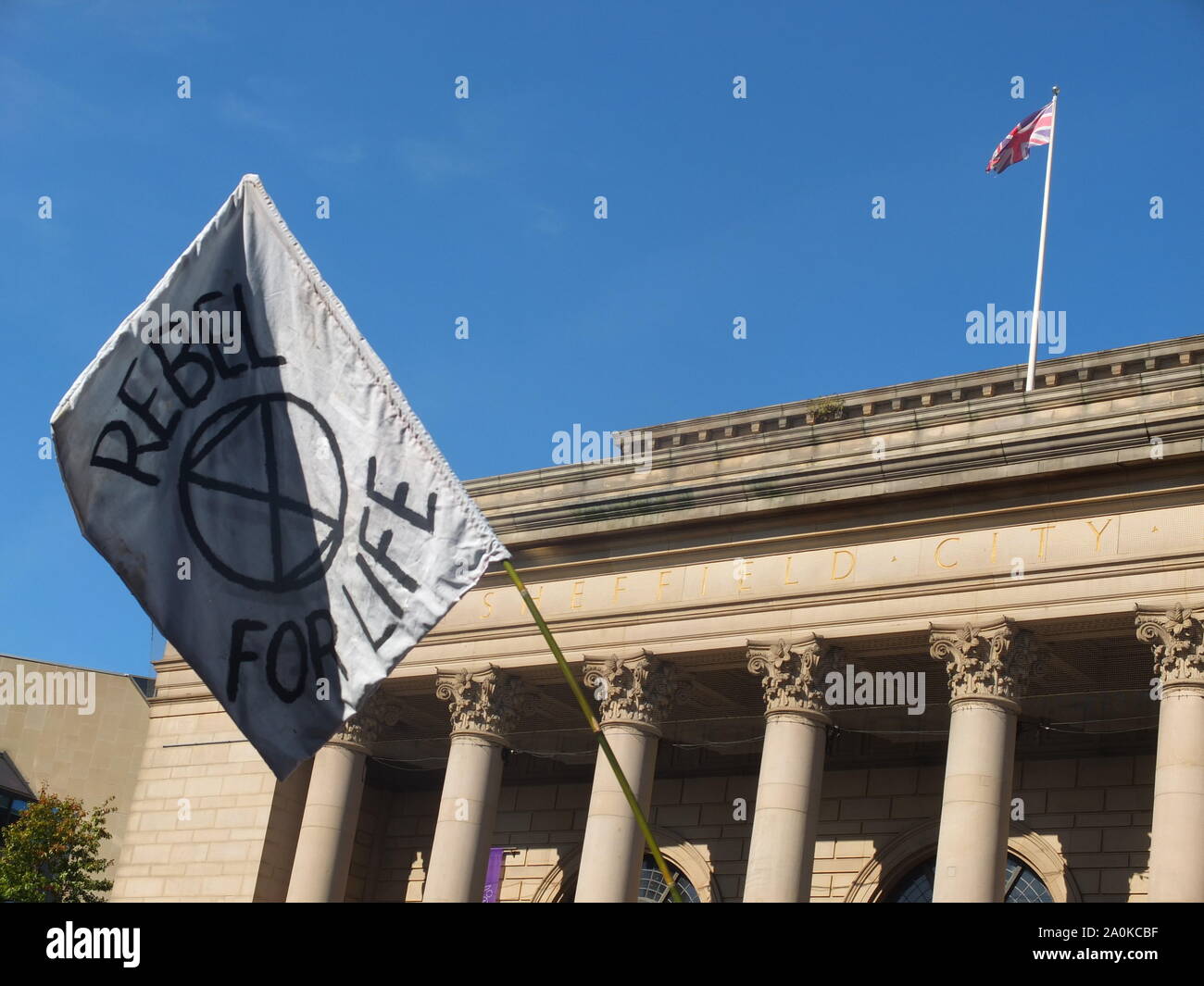 An Extinction Rebellion 'Rebel For Life' flag waving in front of ...