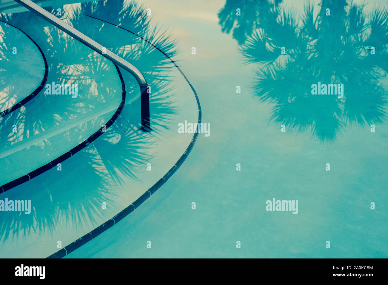 Teal swimming pool still-life shows art deco style steps with the ...