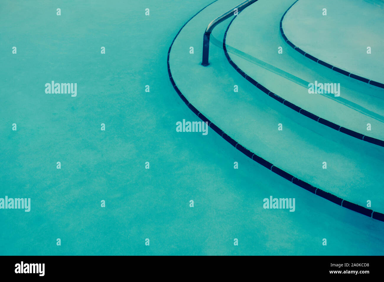 Teal Mid Century Pool Showing Stairs and Calming Reflections of Palm ...