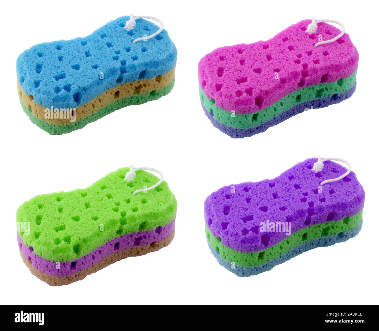 Set of sponges in different colors for washing dishes on a white ...