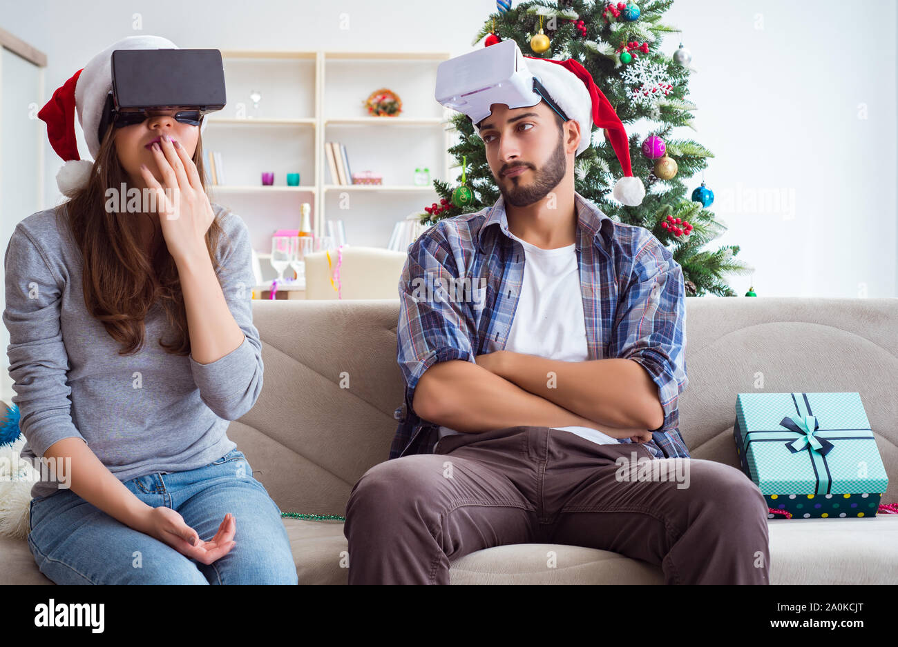 The happy family using virtual reality vr glasses during christmas ...