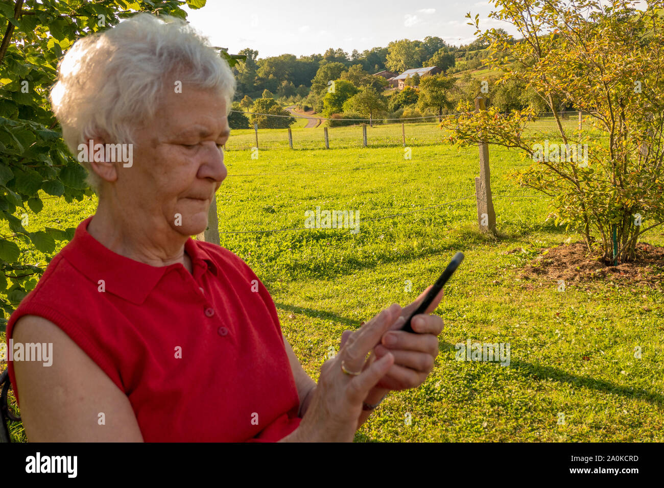 Senior citizen talking on a phone hi-res stock photography and images ...