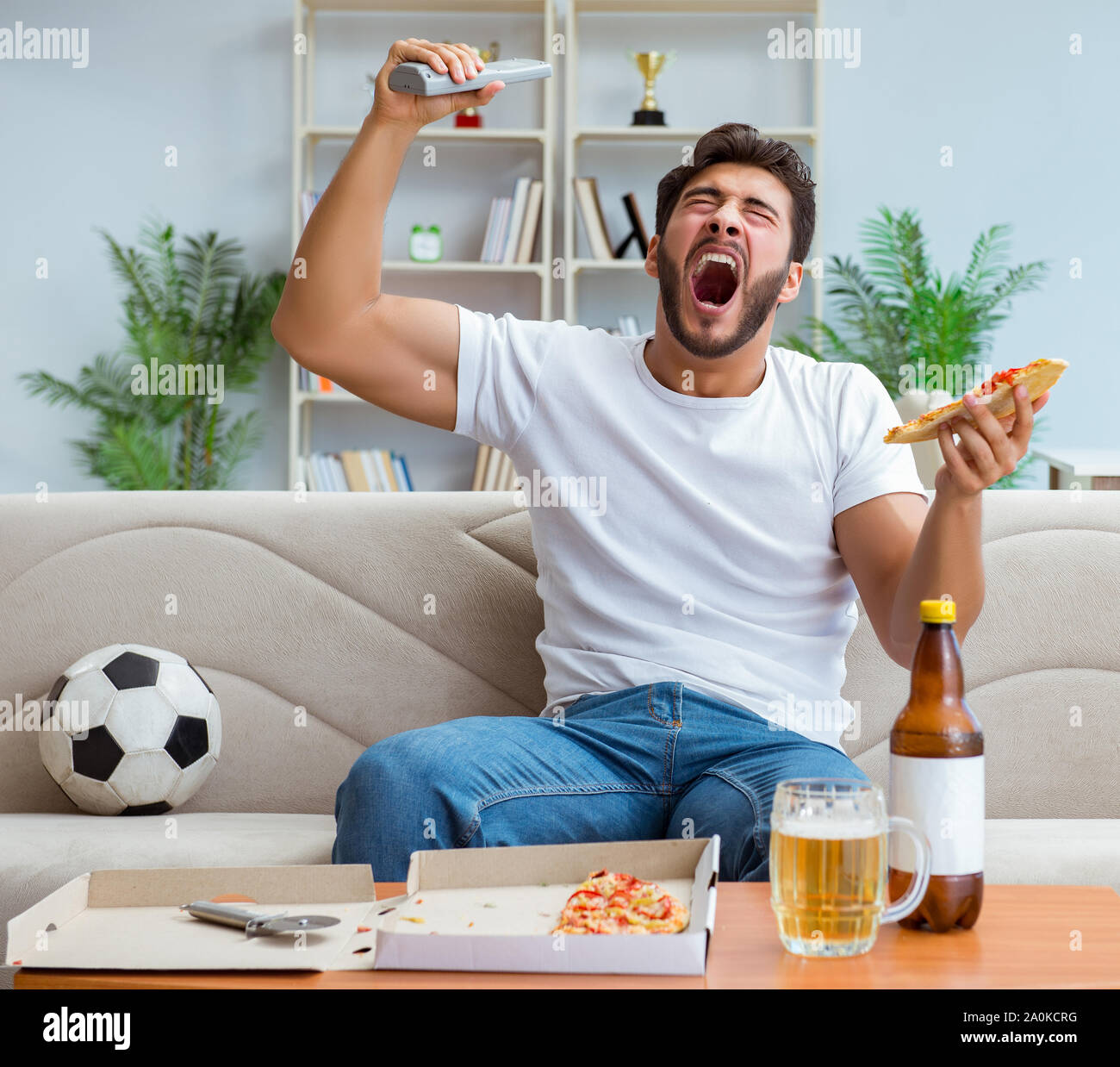 The man eating pizza having a takeaway at home relaxing resting Stock ...