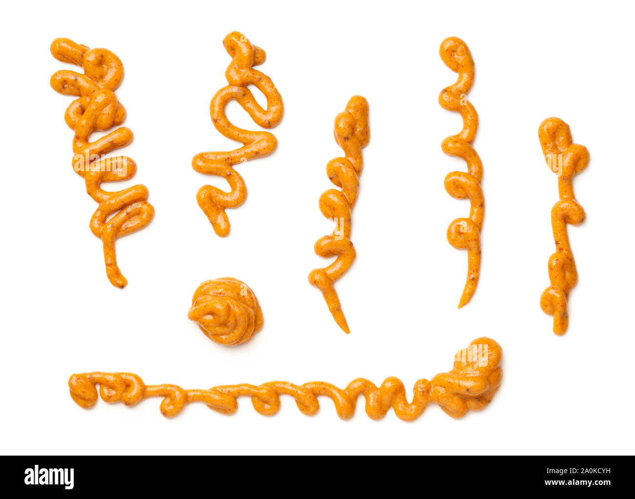 Spicy mustard splashes isolated on white background. Top view, flat lay ...